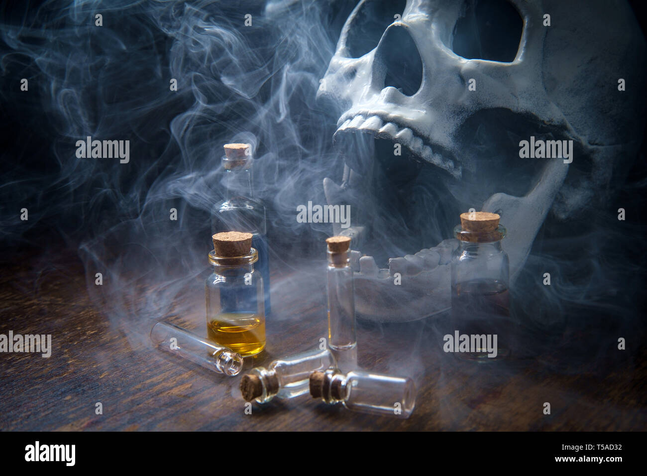 Witches magic potion poison bottles with vapors and human skull Stock ...