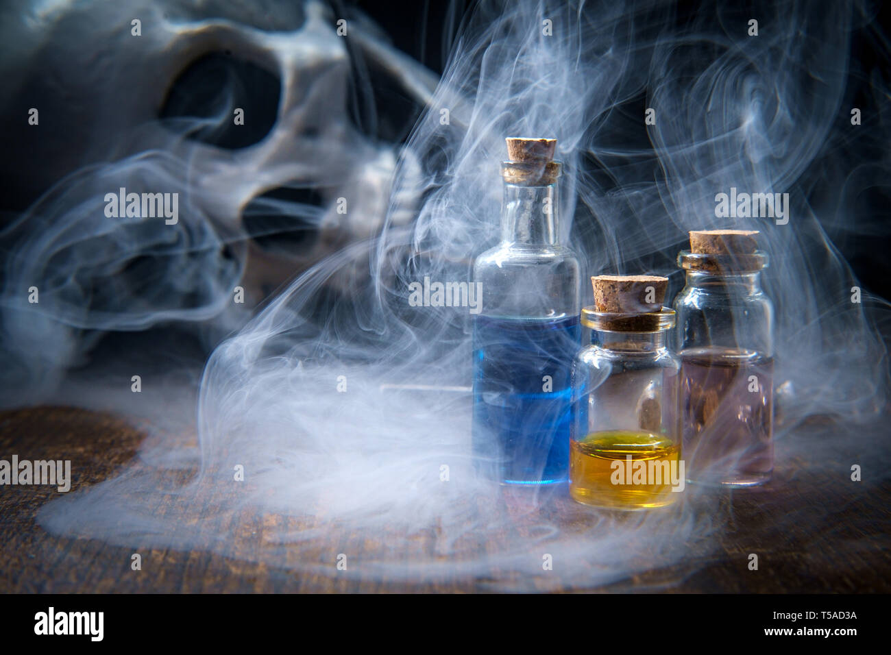 Witches magic potion poison bottles with vapors and human skull Stock ...