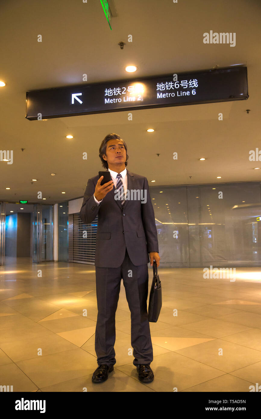 Business man standing in the subway Stock Photo - Alamy