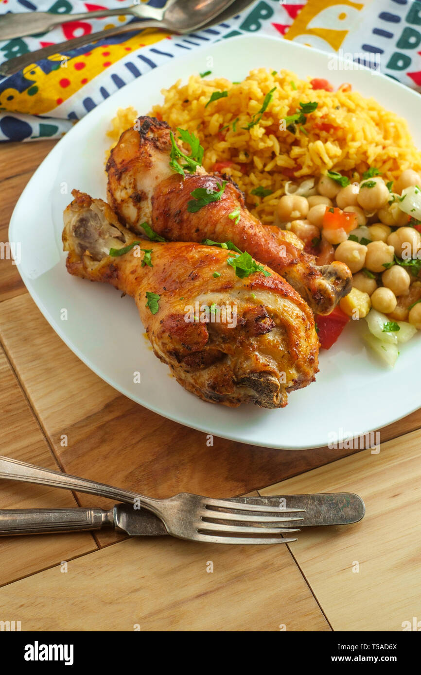 Portuguese piri piri chicken with chickpea salad and yellow rice Stock ...