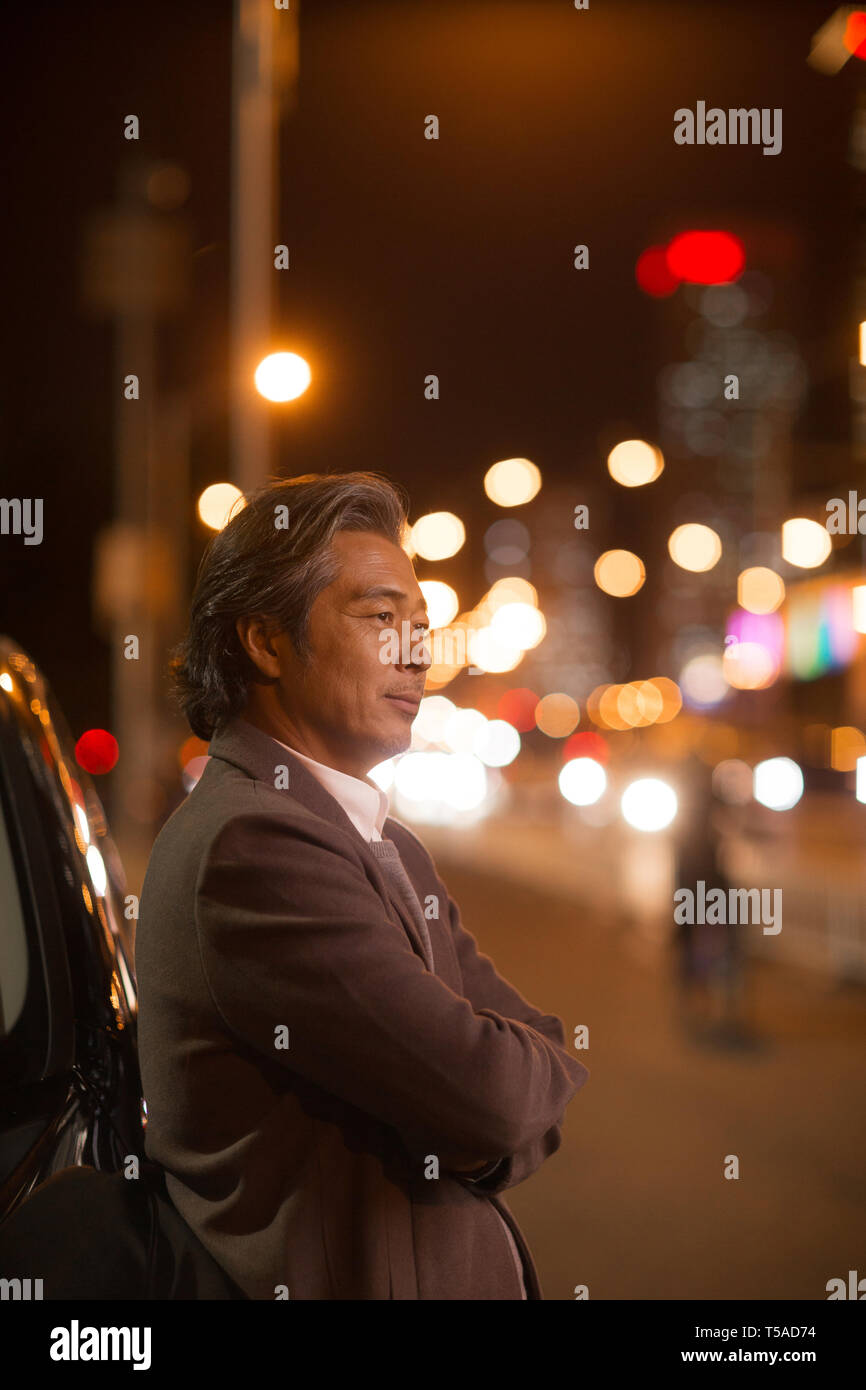 Business man standing outside Stock Photo - Alamy