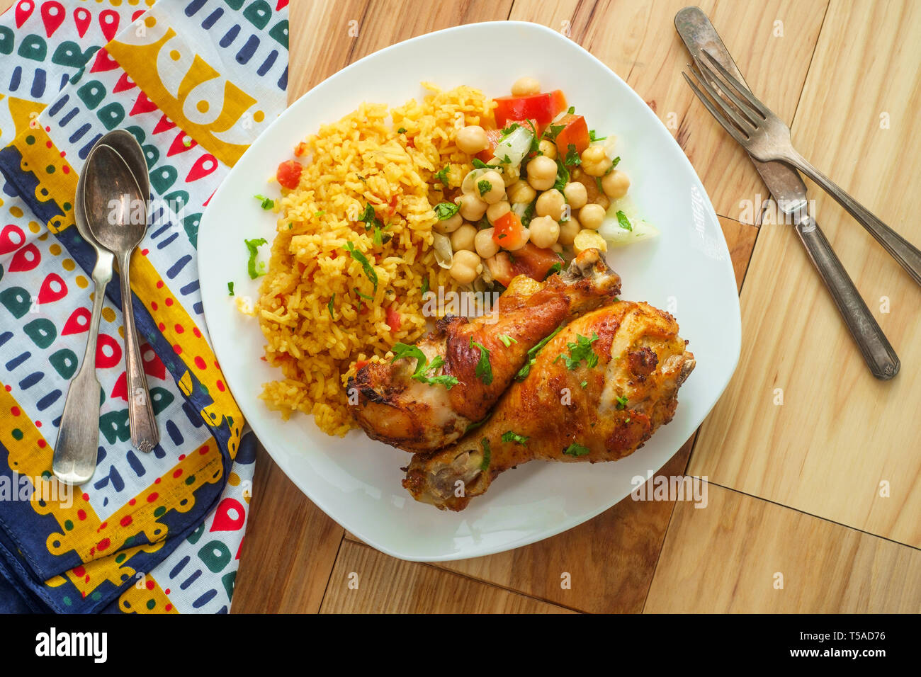 Portuguese piri piri chicken with chickpea salad and yellow rice Stock ...
