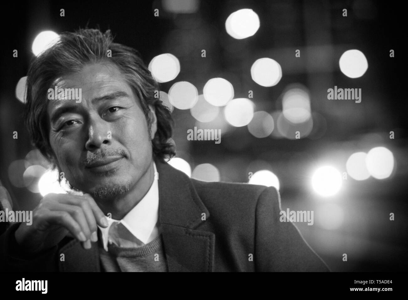 Business man standing outside Stock Photo - Alamy