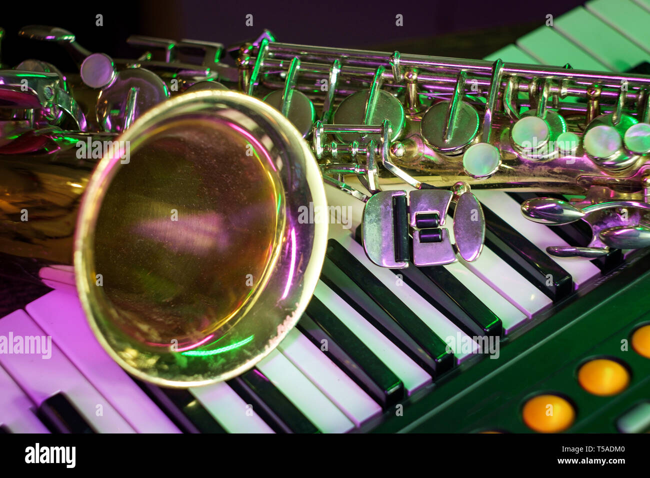Old and worn Jazz saxophone and piano keyboard musical show and ...