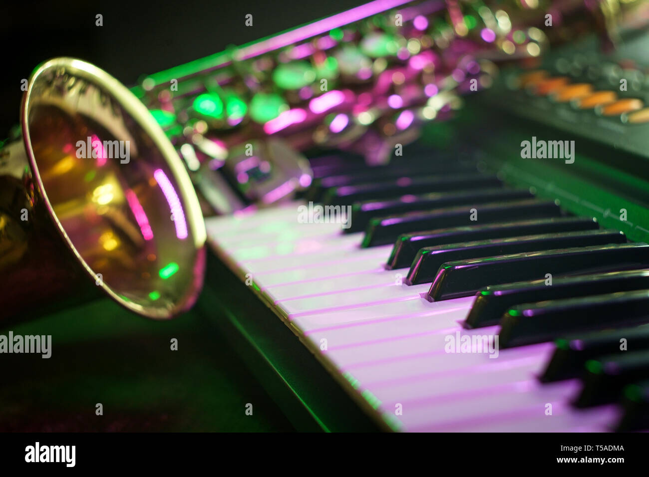 Old and worn Jazz saxophone and piano keyboard musical show and ...