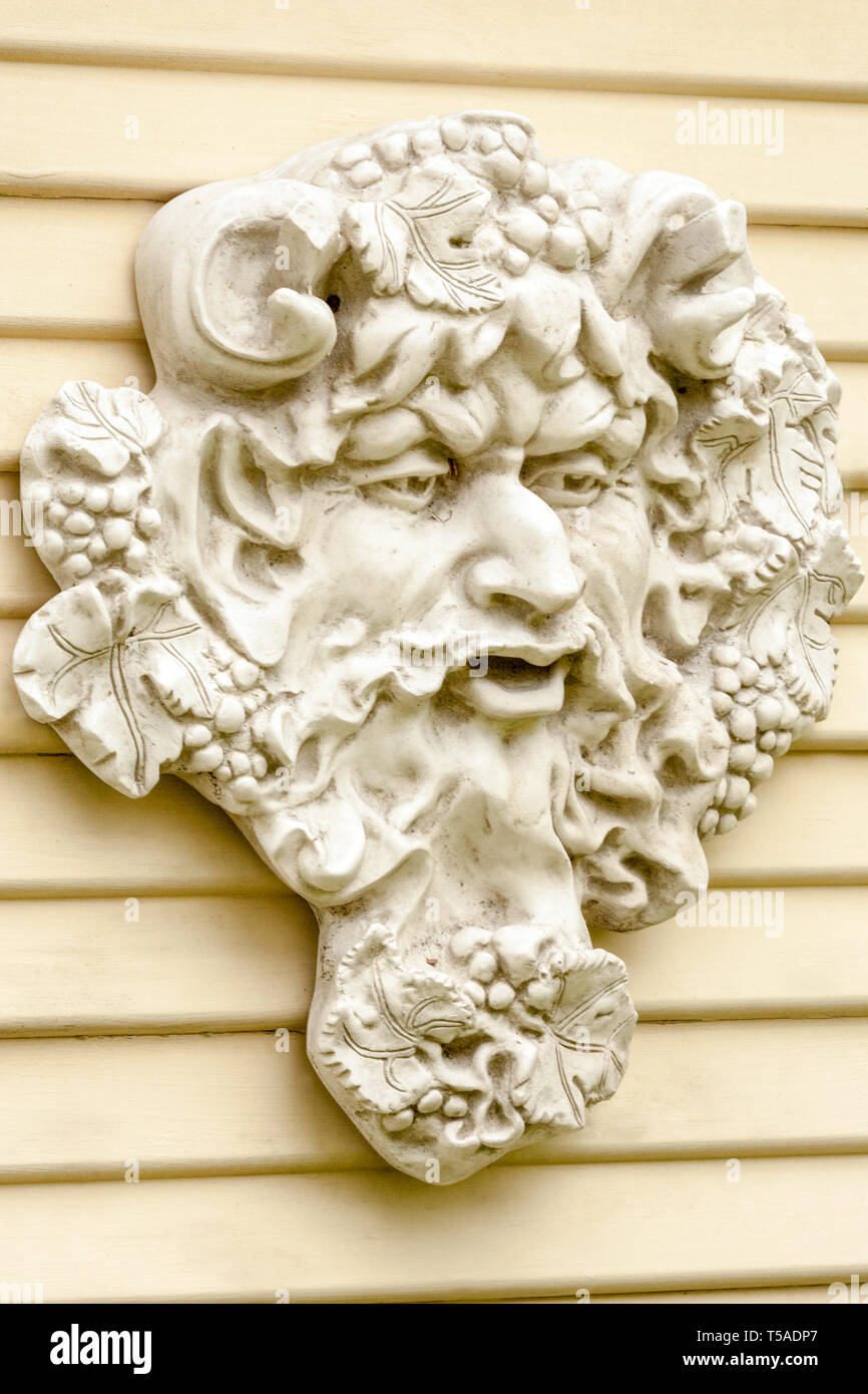 Houston, Texas, USA. Garden decoration of a relief of Bacchus ...
