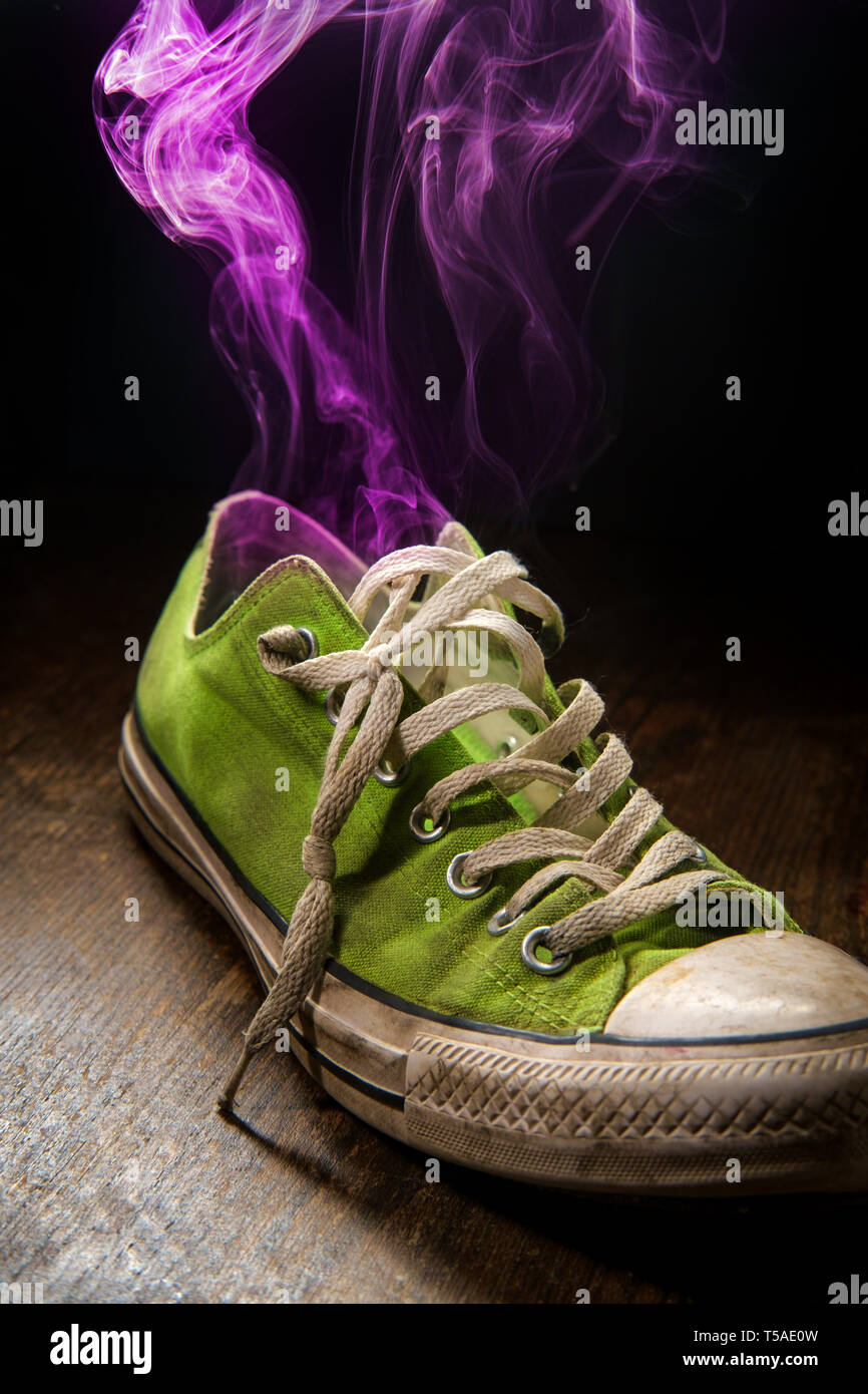 Mens smelly sneaker with colorful visible odor vapor Stock Photo - Alamy