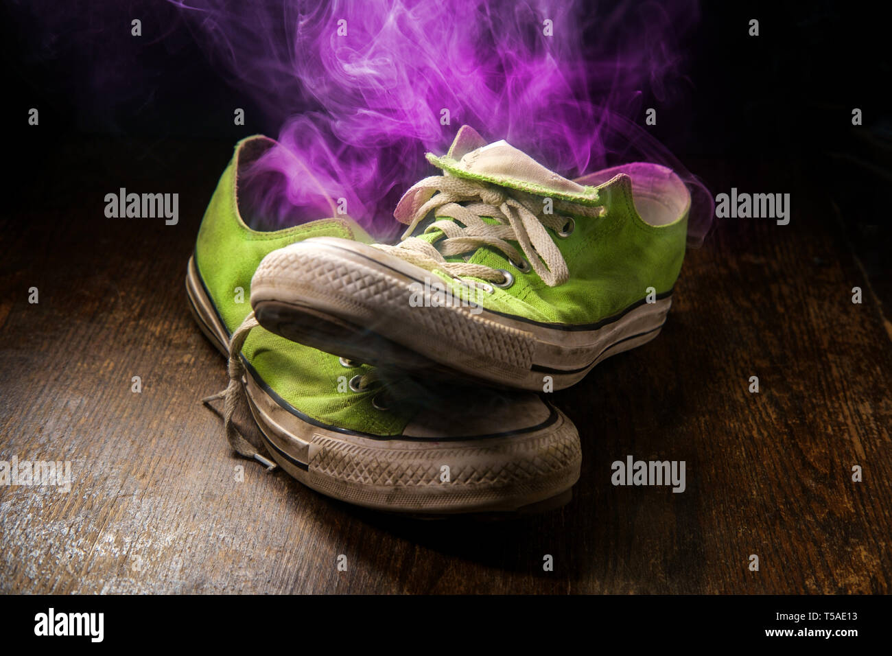 Mens smelly sneaker with colorful visible odor vapor Stock Photo - Alamy