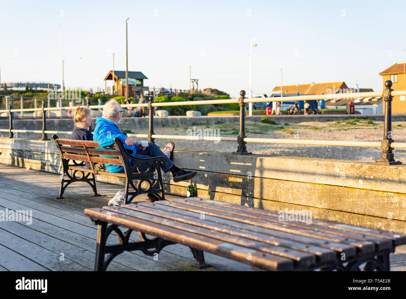 Elderly couple sitting together on a bench on Littlehampton seafront ...