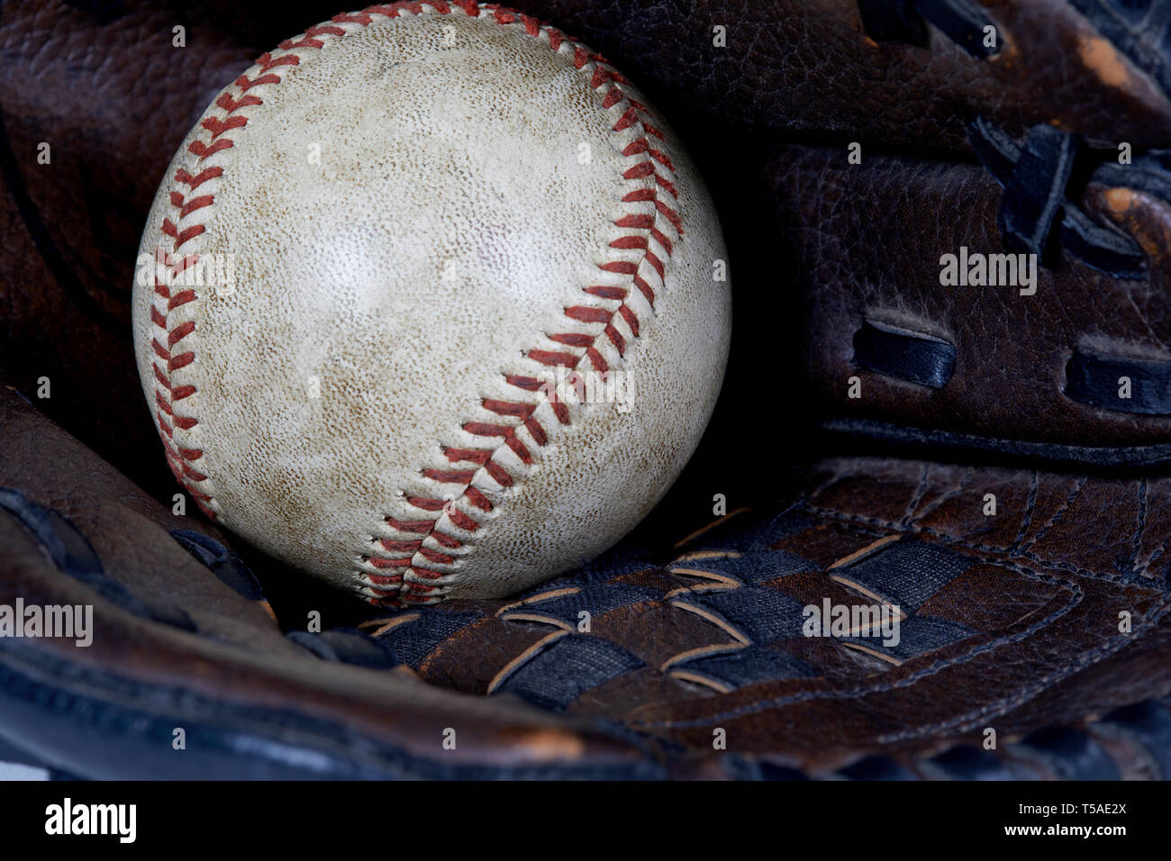 Used baseball and baseball glove isolated on white Stock Photo - Alamy