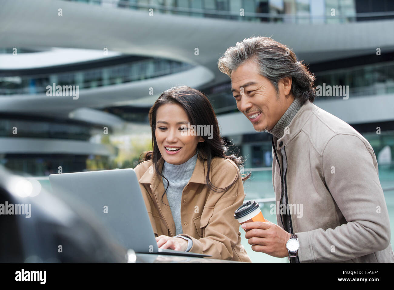 Business people use computers in the outdoor Stock Photo - Alamy