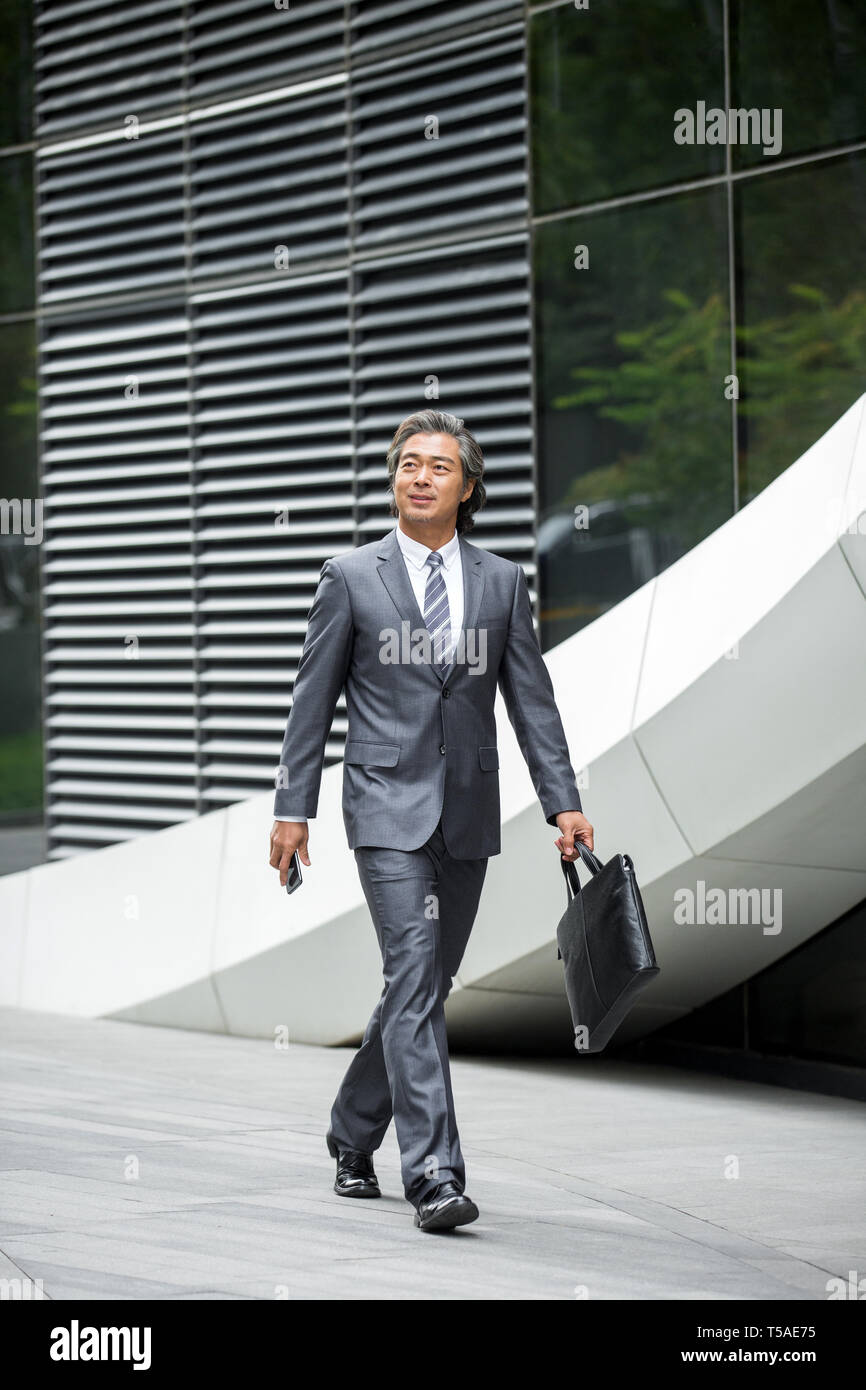 Walking in the business man Stock Photo - Alamy