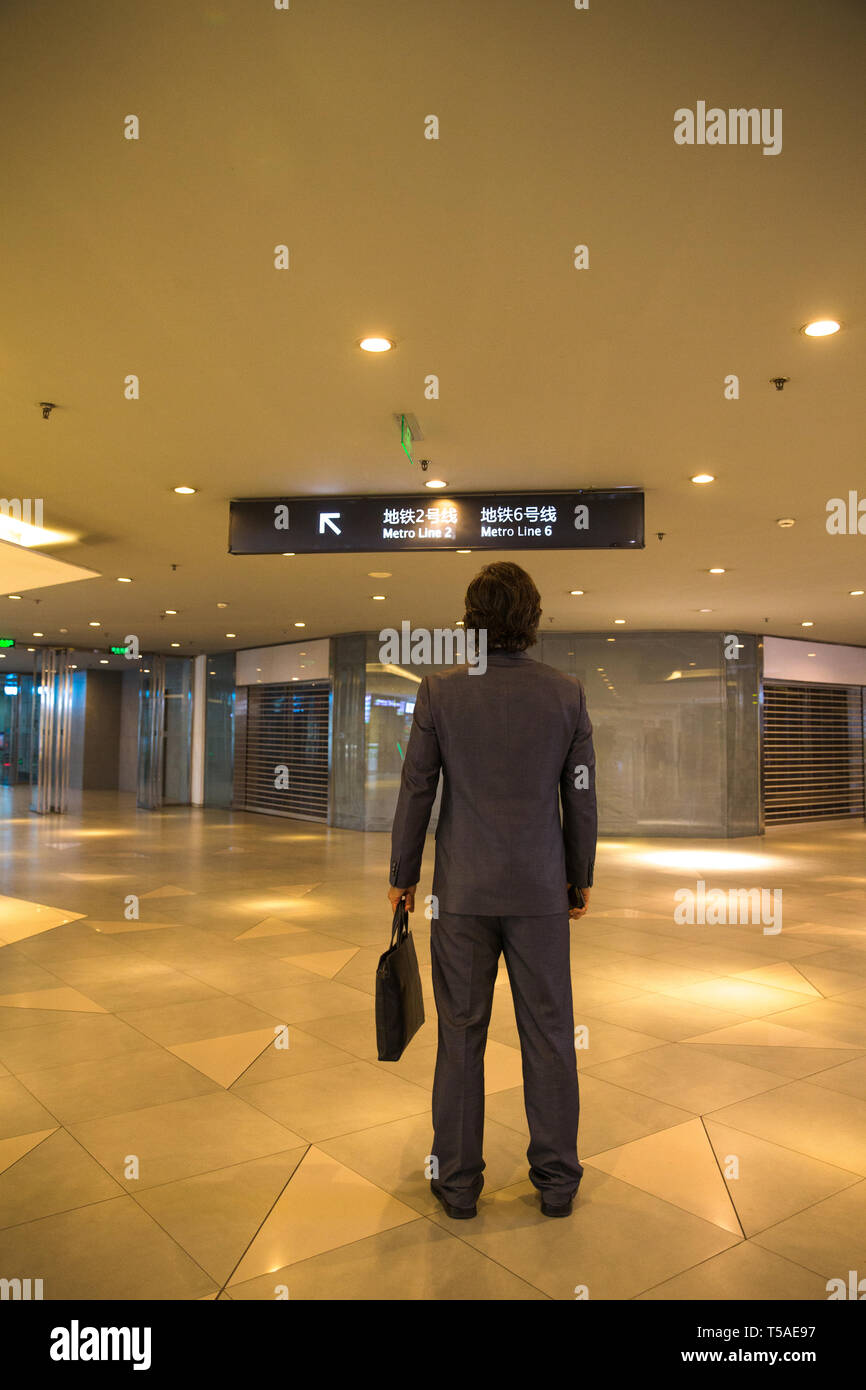 Business man standing in the subway Stock Photo - Alamy