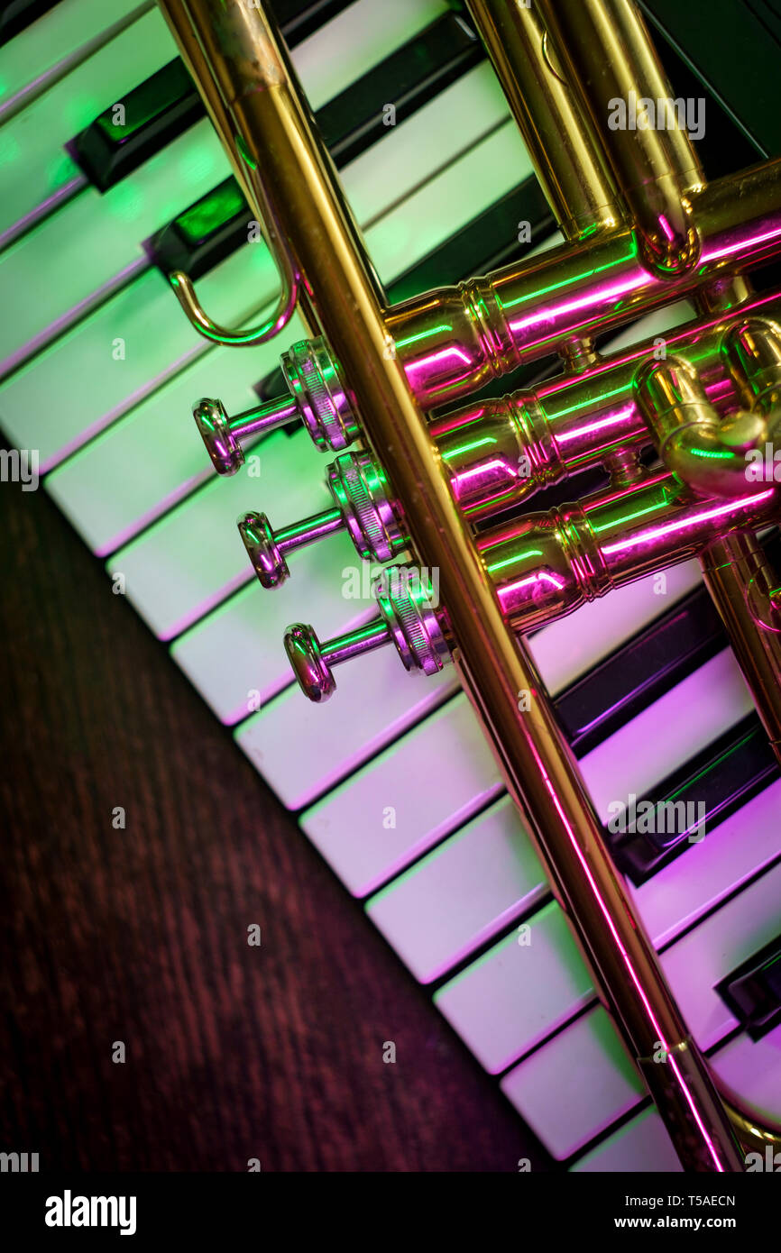 Old and worn Jazz trumpet and piano keyboard musical show and ...