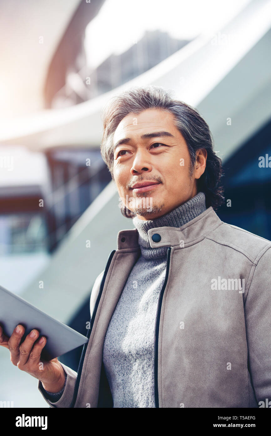Business man with tablets Stock Photo - Alamy