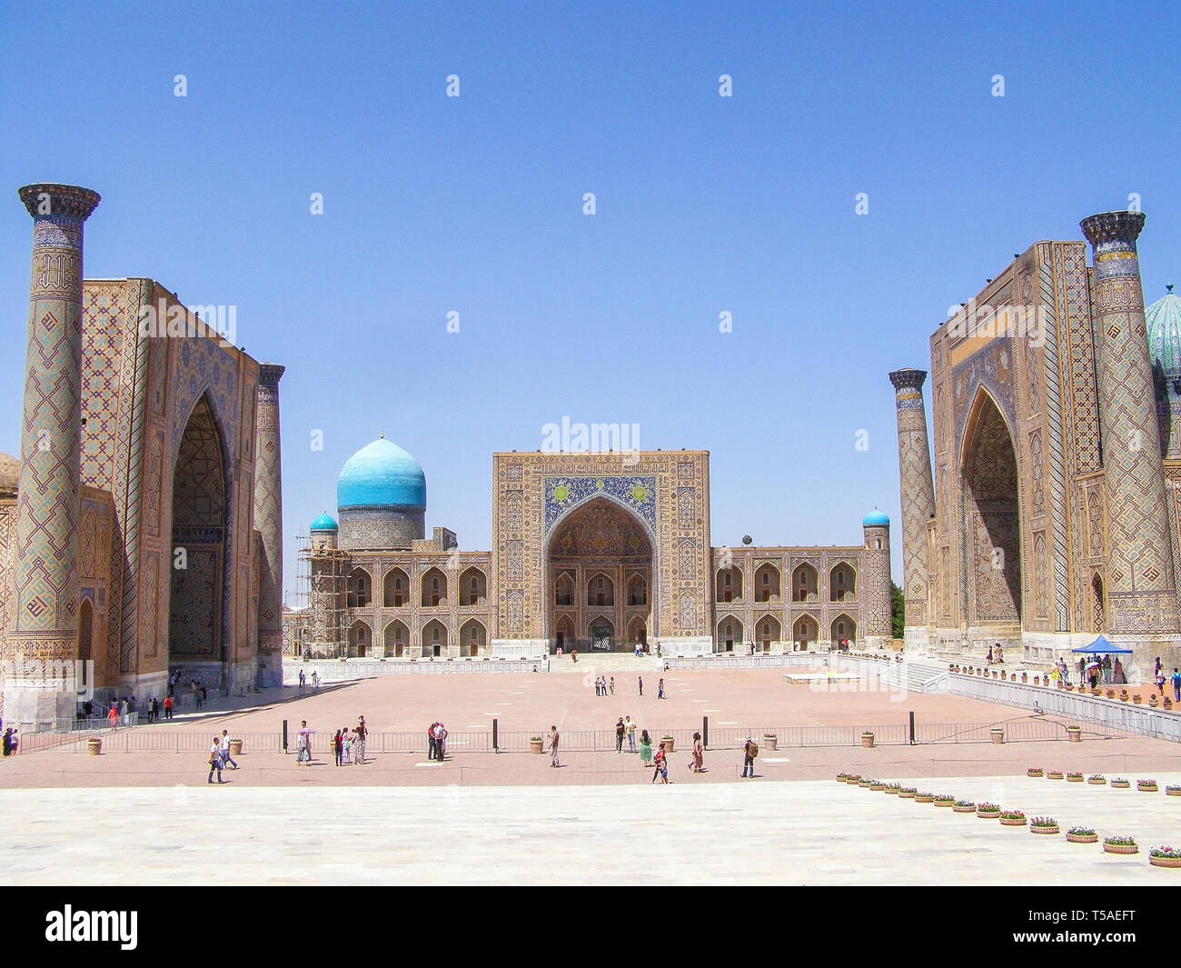 SAMARKAND, UZBEKISTAN - AUGUST 17 2018: Registan Square with people ...