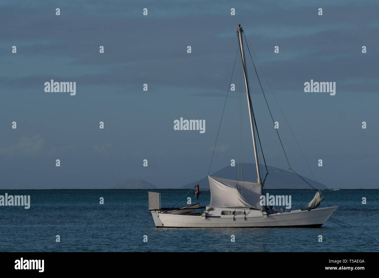 A yacht setting sail Stock Photo - Alamy