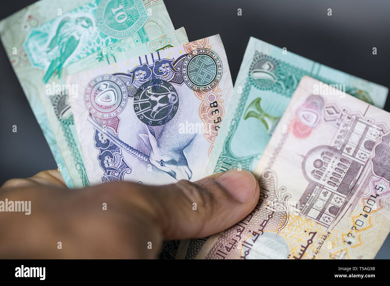 Uae dirhams hand hi-res stock photography and images - Alamy