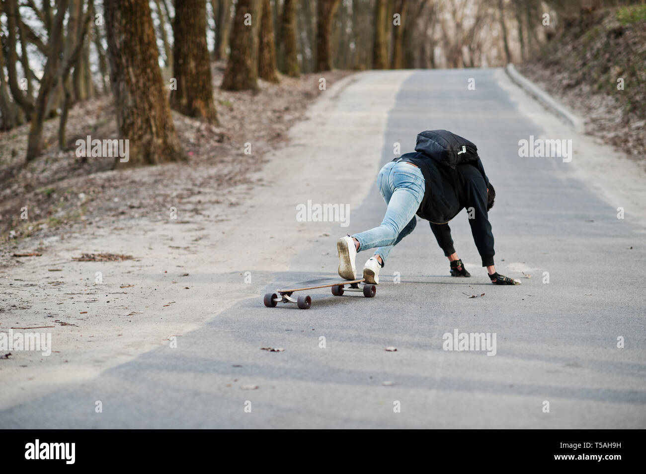 Fail falling from a skateboard. Street style arab man in eyeglasses ...