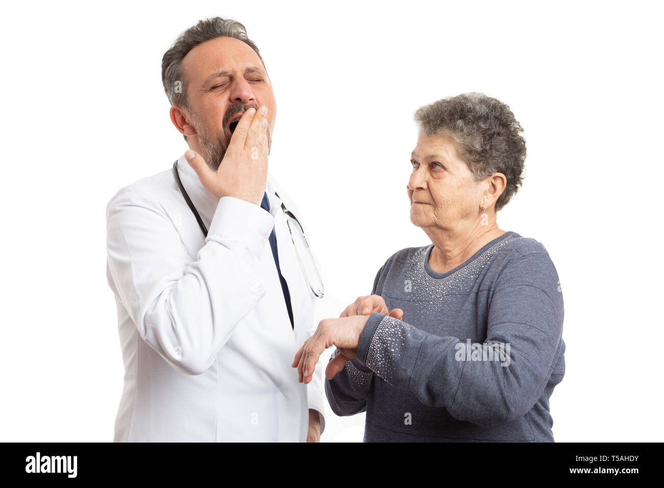 Old woman patient pointing with index finger at wrist for tired doctor ...