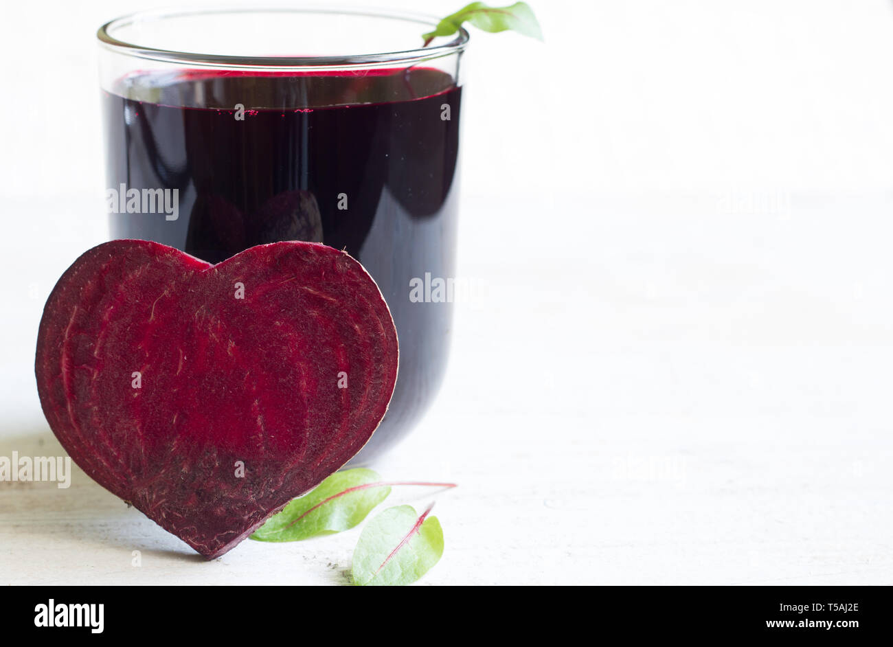 Healthy beetroot with heart shape and juice Stock Photo - Alamy