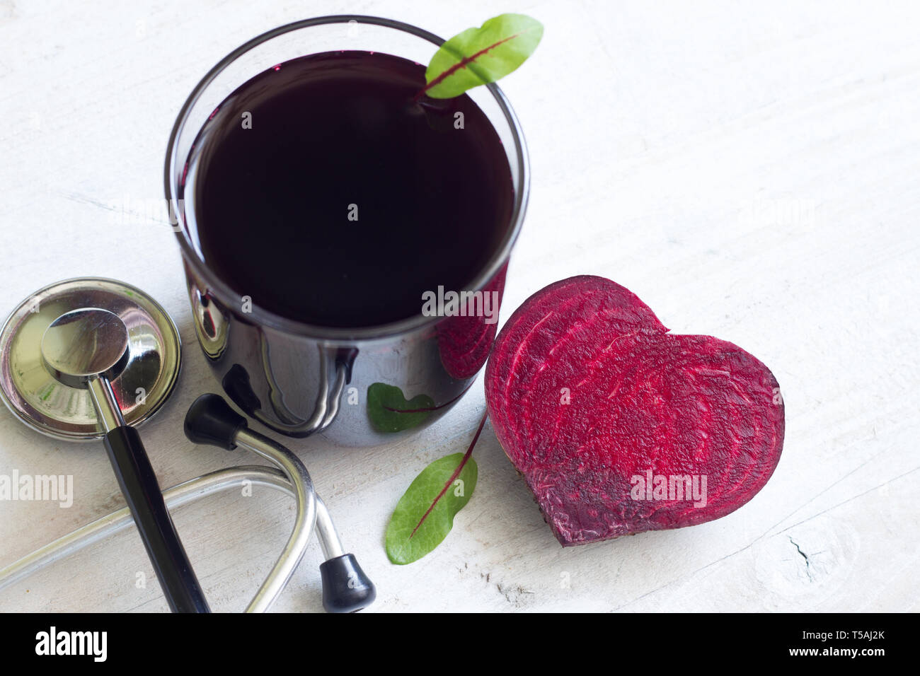 Healthy beetroot with heart shape and juice Stock Photo - Alamy