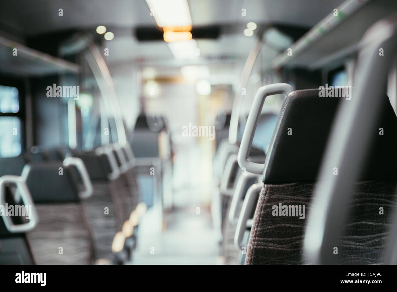 Interior of a public transport train, blurry background Stock Photo - Alamy