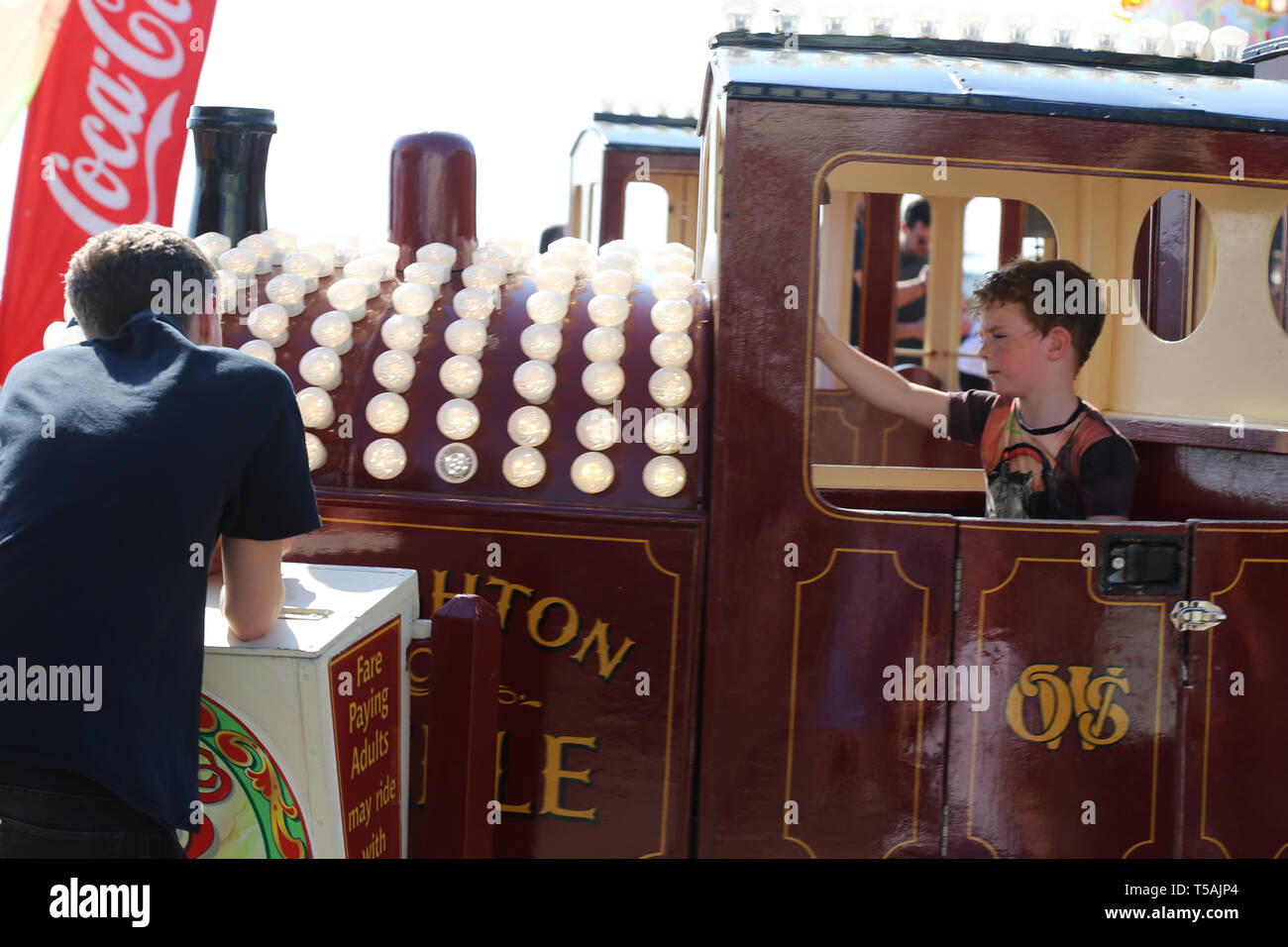 a young boy on the funfair train in Brighton fair Stock Photo - Alamy