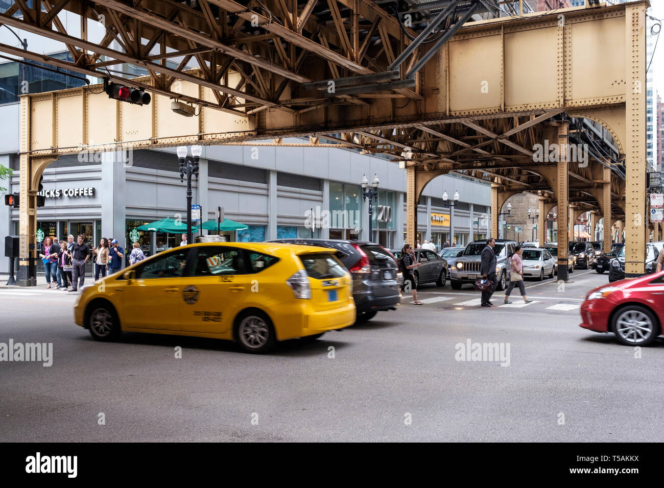 Busy streets under the Loop metro train at Downtown Chicago Stock Photo ...