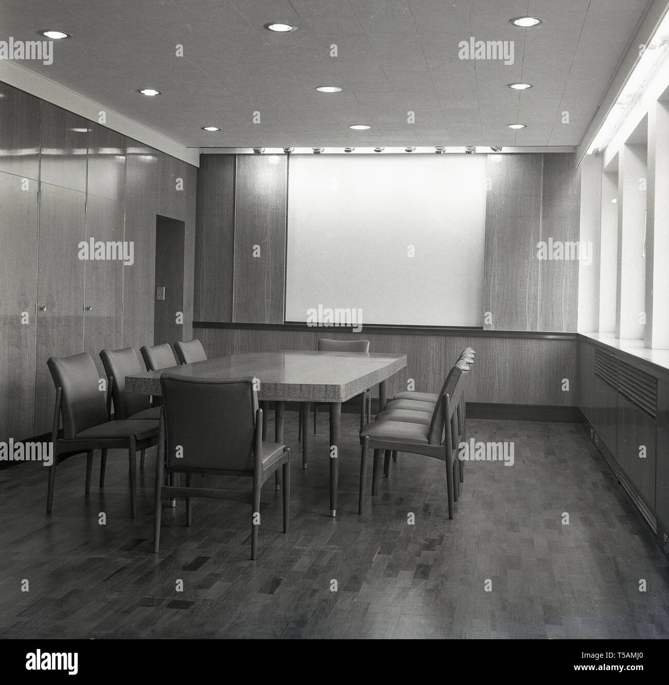 1960s, historical, company boardroom with table and chairs. The room ...