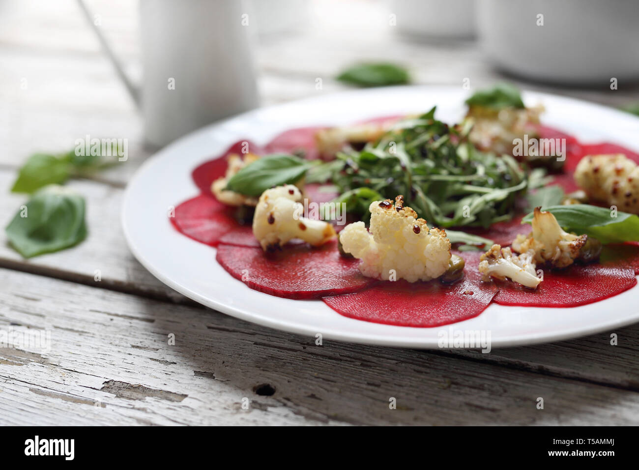 Vegetarian carpaccio of roasted beetroot with cauliflower and green ...