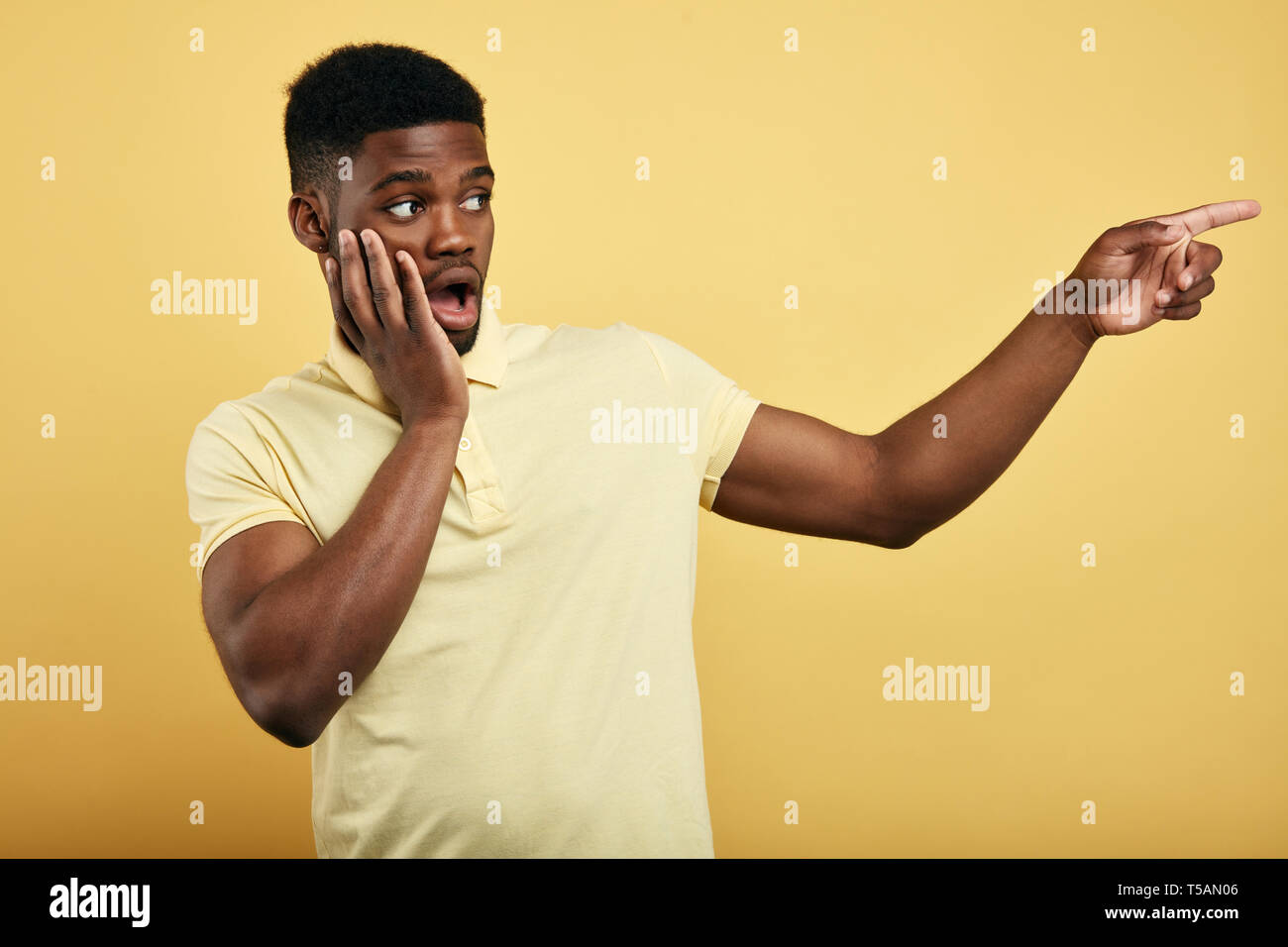 Finger pointing cheek hi-res stock photography and images - Alamy