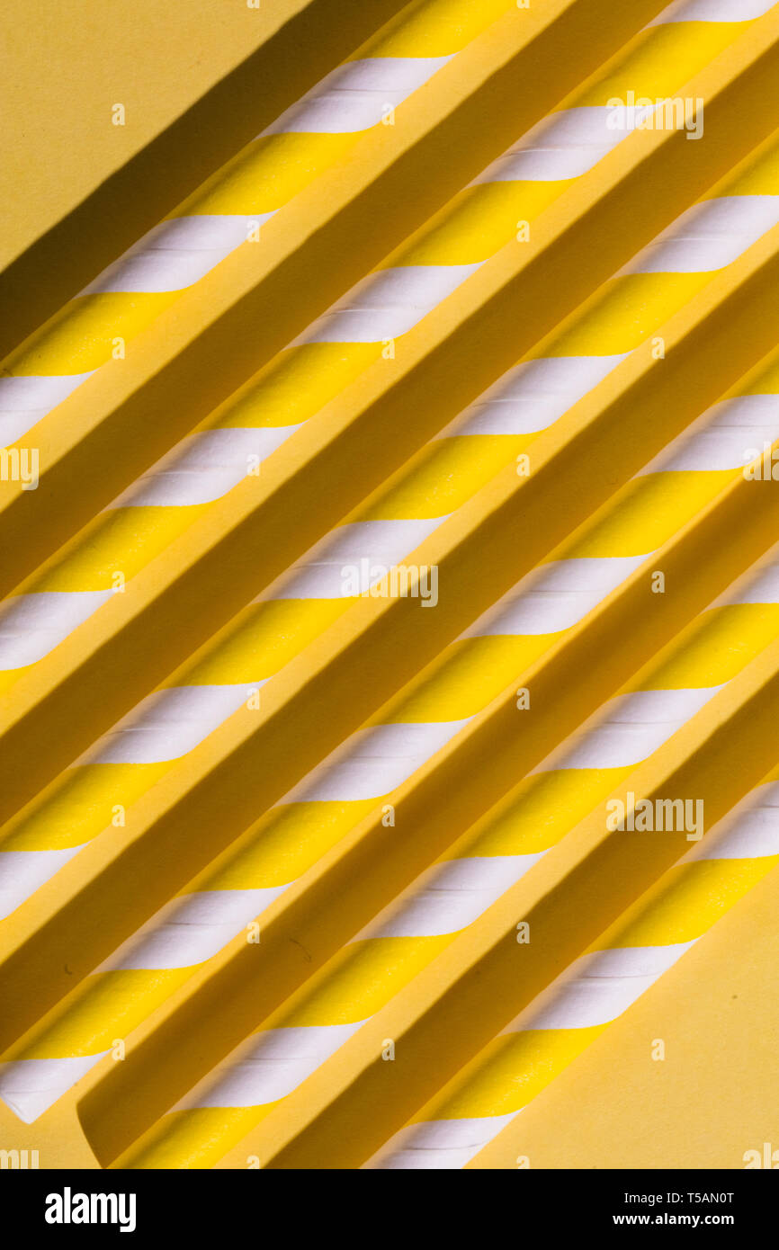 yellow parallel logs on the floor, unusual design concept. pattern with ...