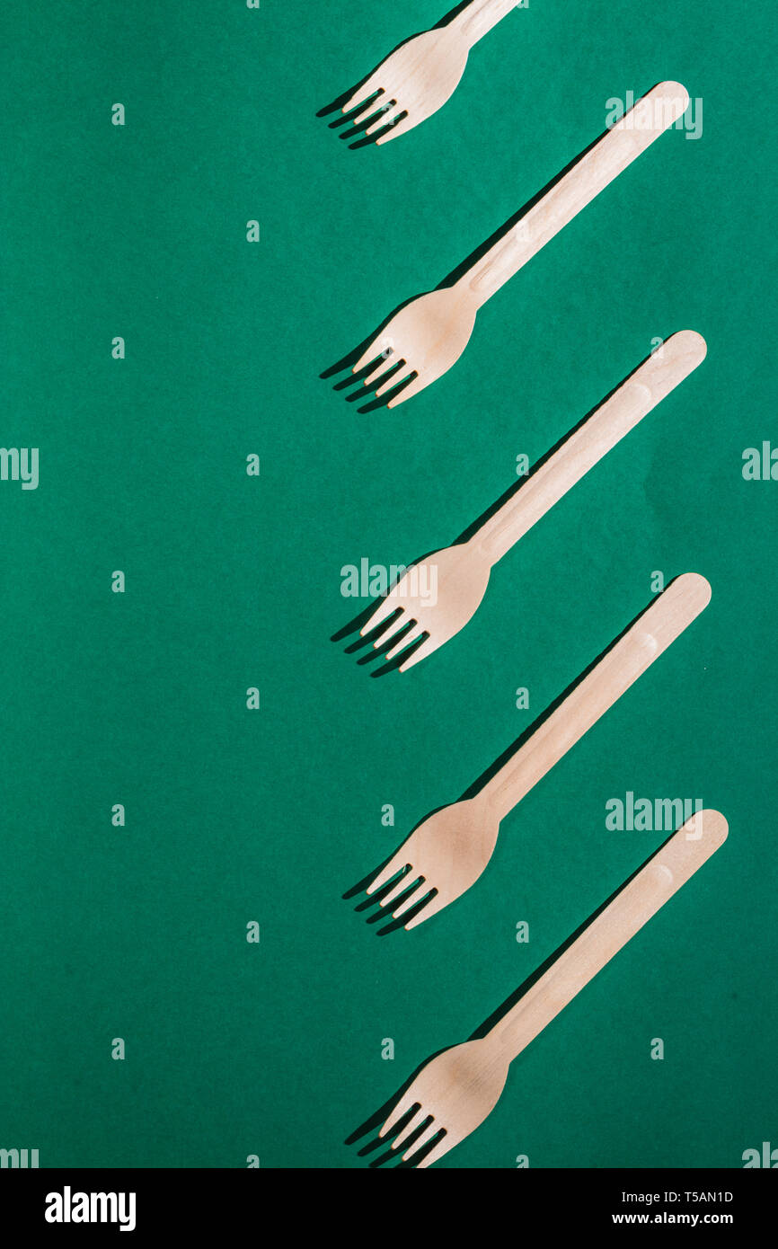 many plastic forks lying next to each other, copy space. art ...