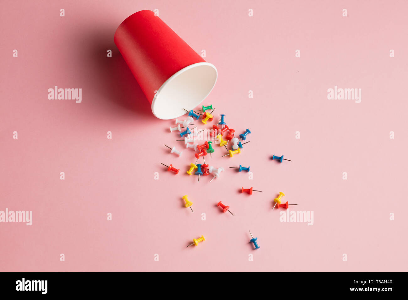 collection of colorful pushpins isolated on pink background. office ...