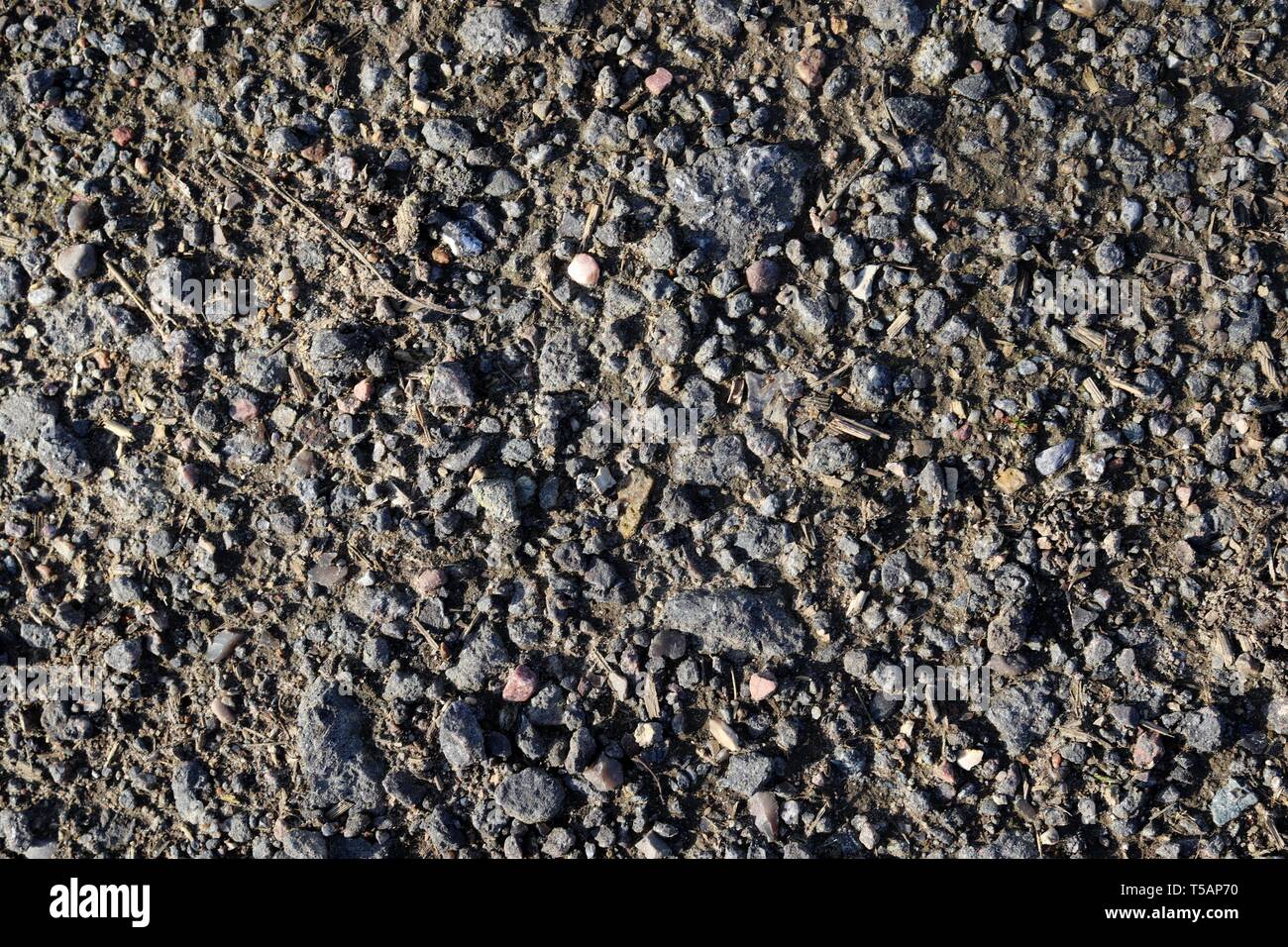 High resolution close up surface texture of gravel on the ground with ...