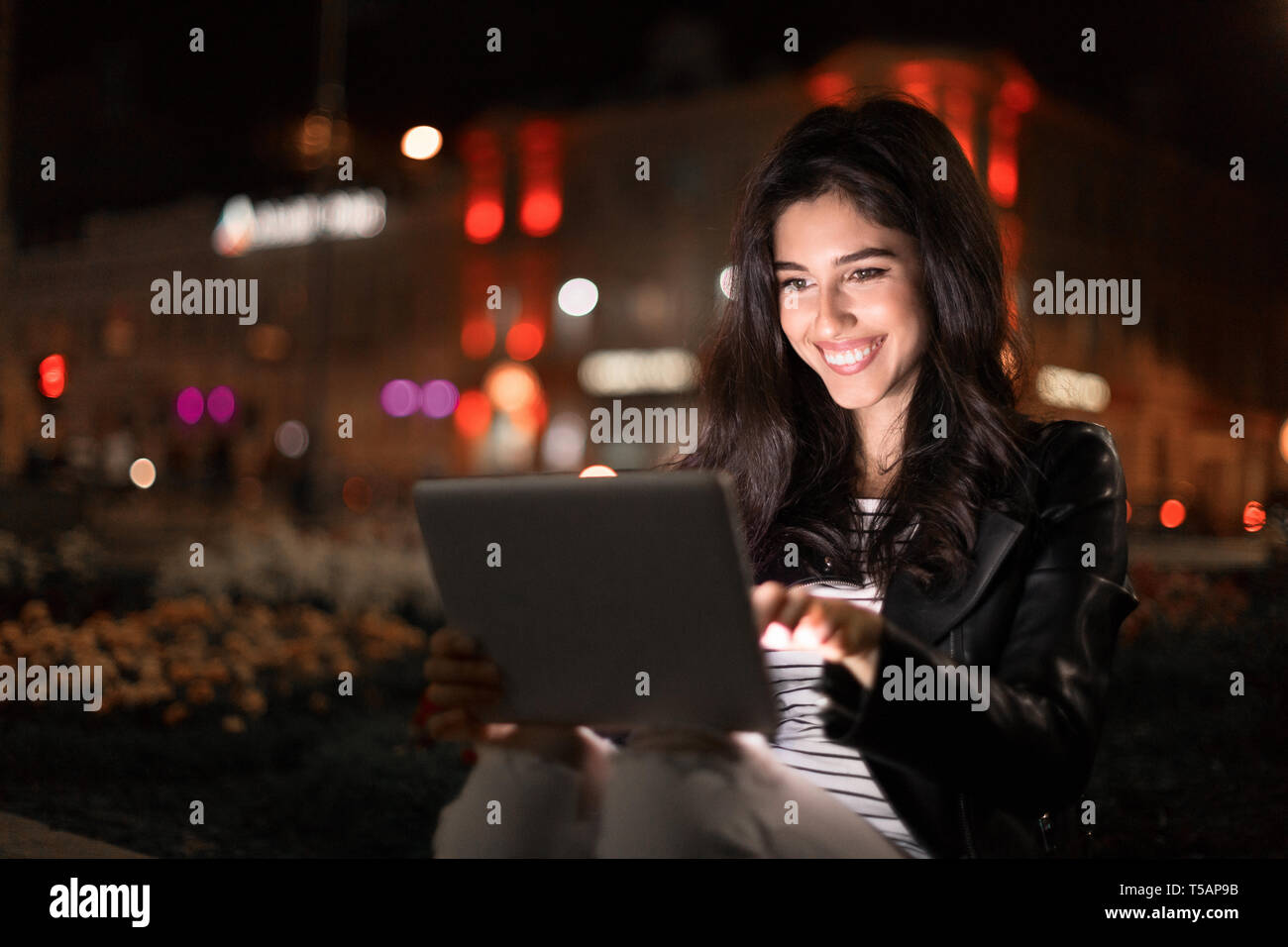 Girl surfing internet and checking social networks in the city Stock ...