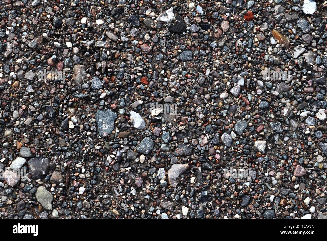 High resolution close up surface texture of gravel on the ground with ...