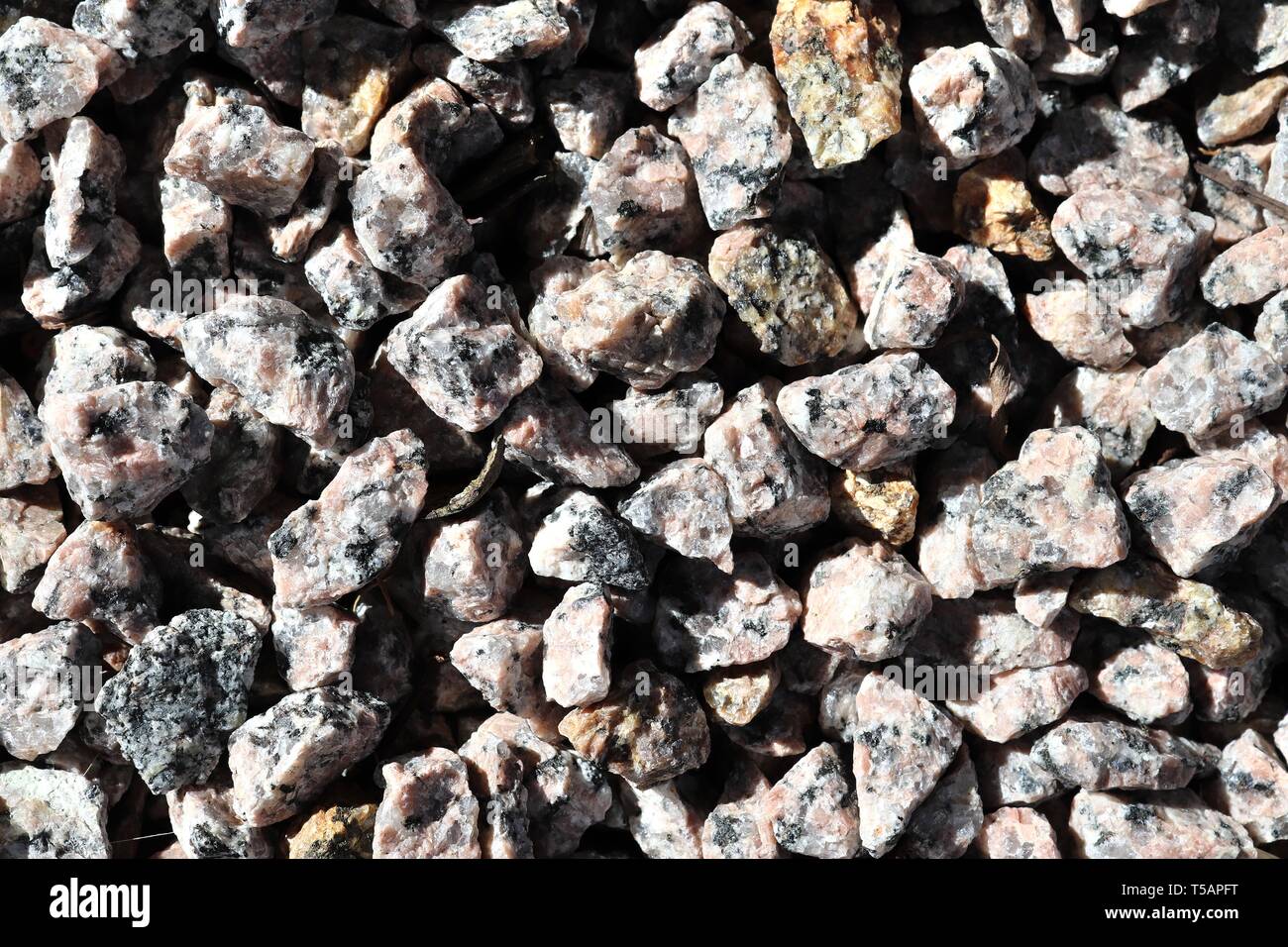 High resolution close up surface texture of gravel on the ground with ...