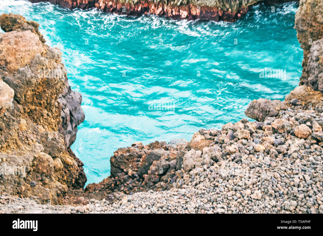 High angle view of rocks by sea Stock Photo - Alamy