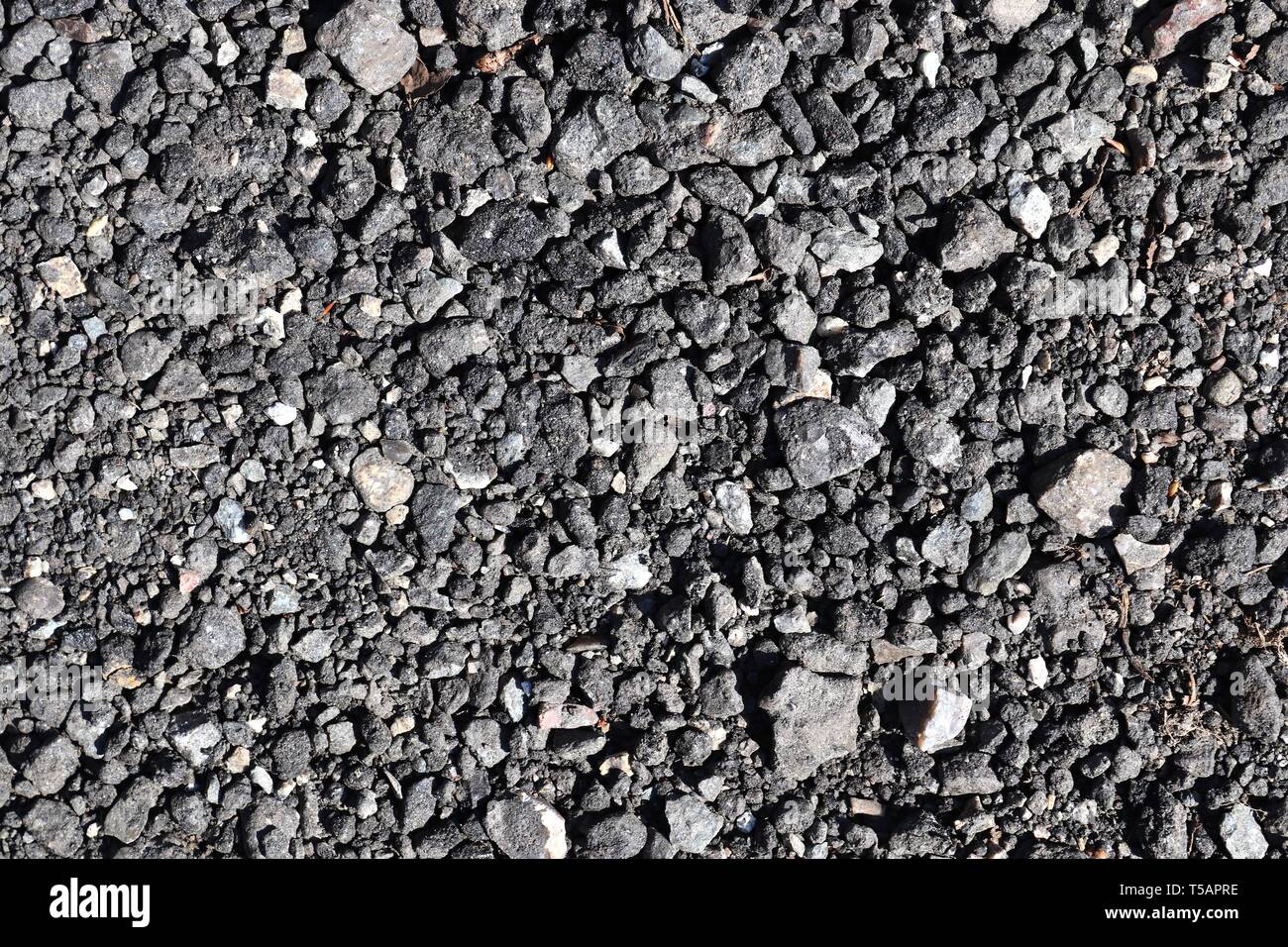 High resolution close up surface texture of gravel on the ground with ...