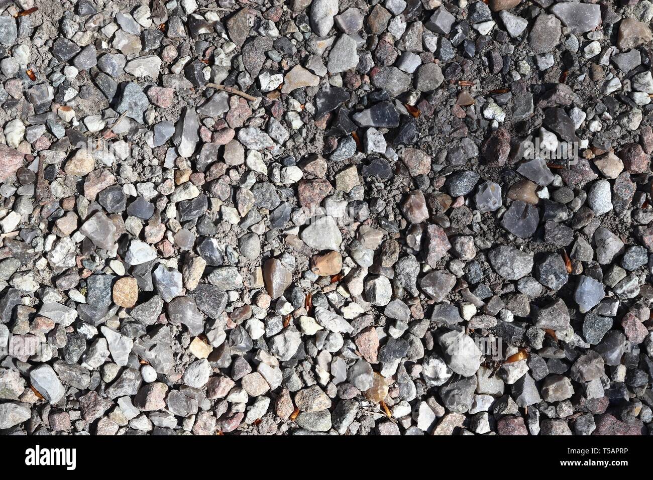 High resolution close up surface texture of gravel on the ground with ...