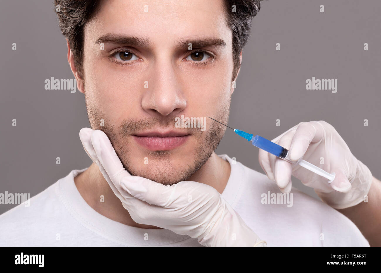 Plastic surgery concept. Man receiving injection in his face Stock ...
