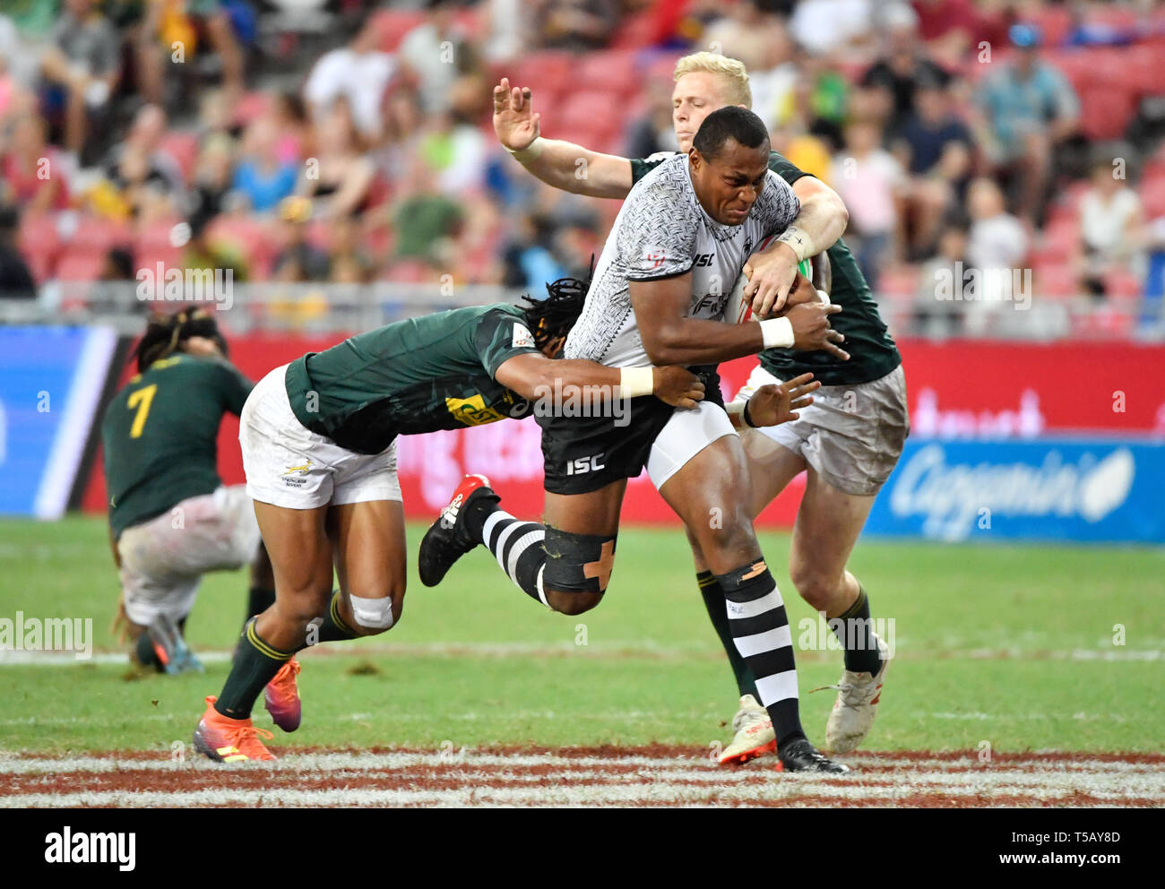 Singapore, Singapore. 14th Apr, 2019. Fiji's Sevuloni Mocenacagi drives ...