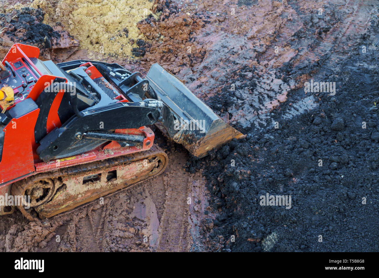 Bucket wheeled loader on the construction. Close-up of the bucket. Side ...