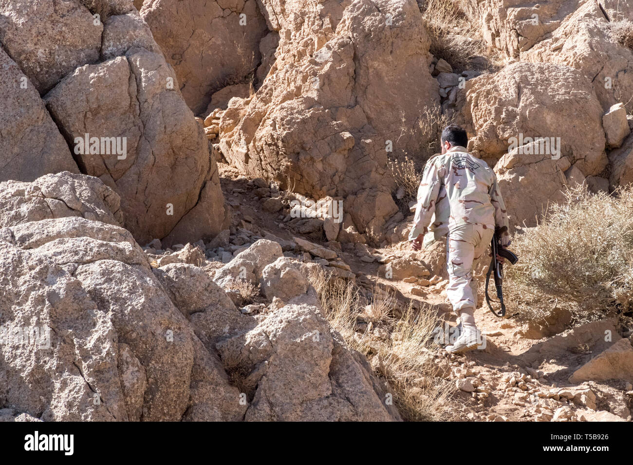 Lonely Iranian Revolutionary Guard With A Gun Watching Smugglers Coming ...