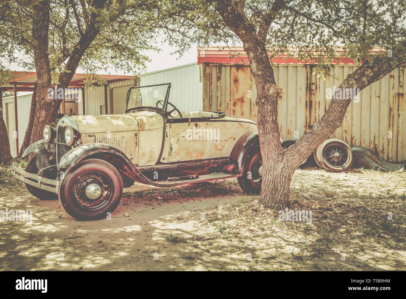 Old rusty vintage car abandoned Stock Photo - Alamy