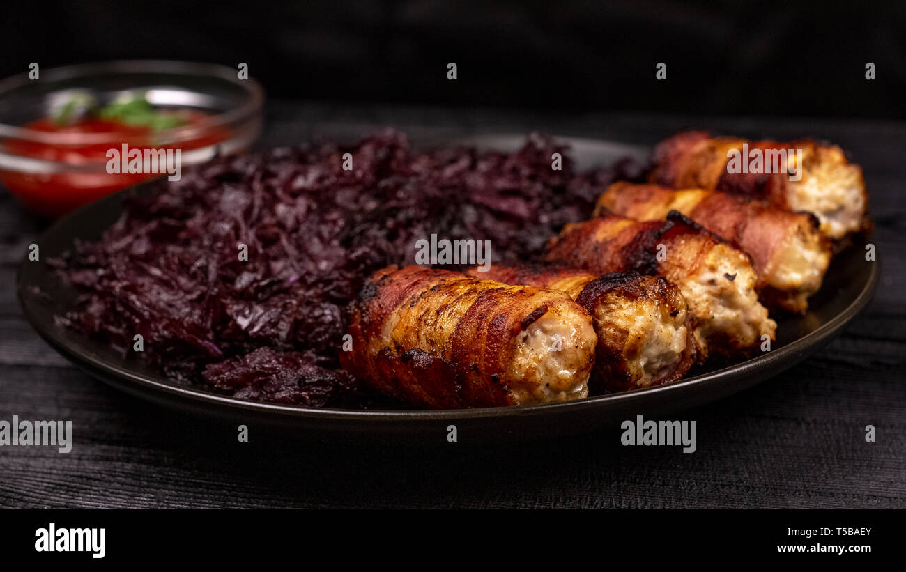 Fried homemade grilled sausages or chevapchichi with stewed sauerkraut ...
