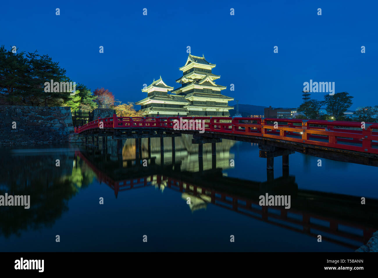 Matsumoto Castle with the red bridge night in Matsumoto, Japan Stock ...