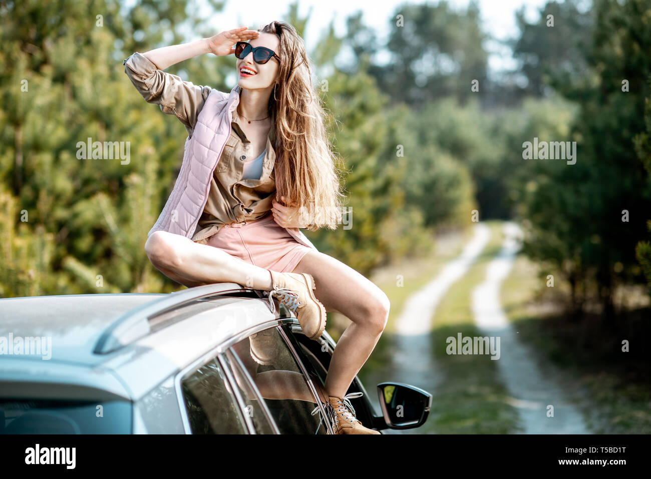 Girl on car roof hi-res stock photography and images - Alamy